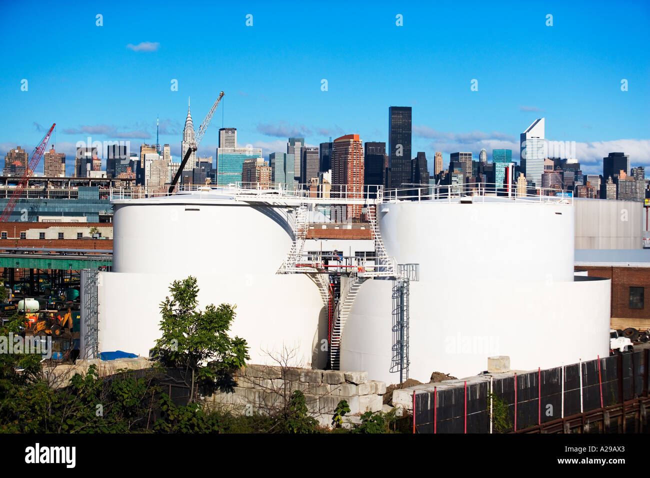 FUEL TANKS IN FOREGROUND OF NEW YORK CITY, EAST SIDE Stock Photo - Alamy