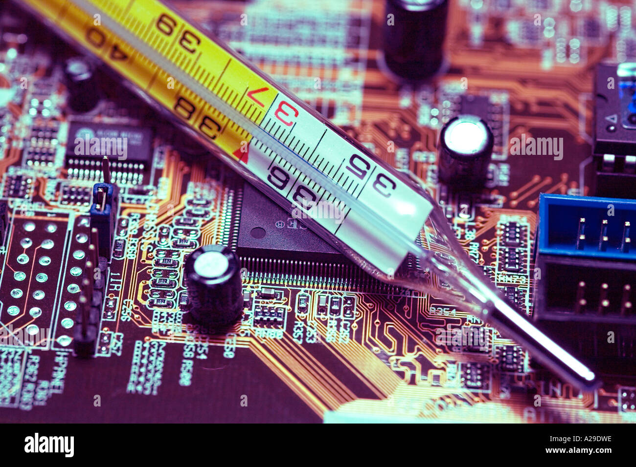 Thermometer over computer main board Stock Photo - Alamy