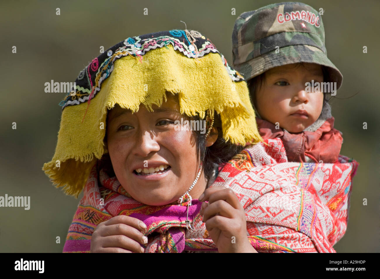Local Peruvian people in traditional dress visit the base camp at the ...