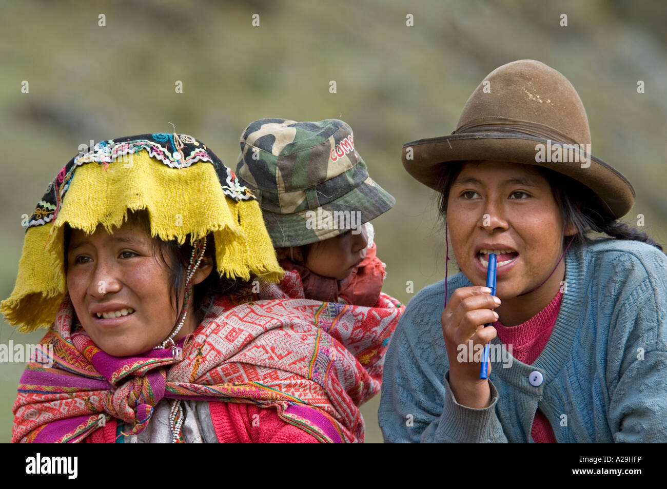 Local Peruvian people in traditional dress visit the base camp at the ...
