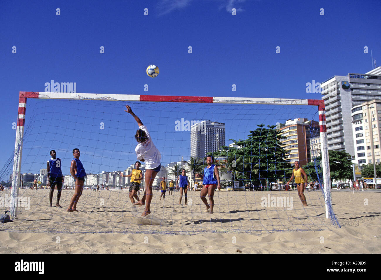 Men playing football on the sand at Copacabana Beach in Rio de Janeiro ...