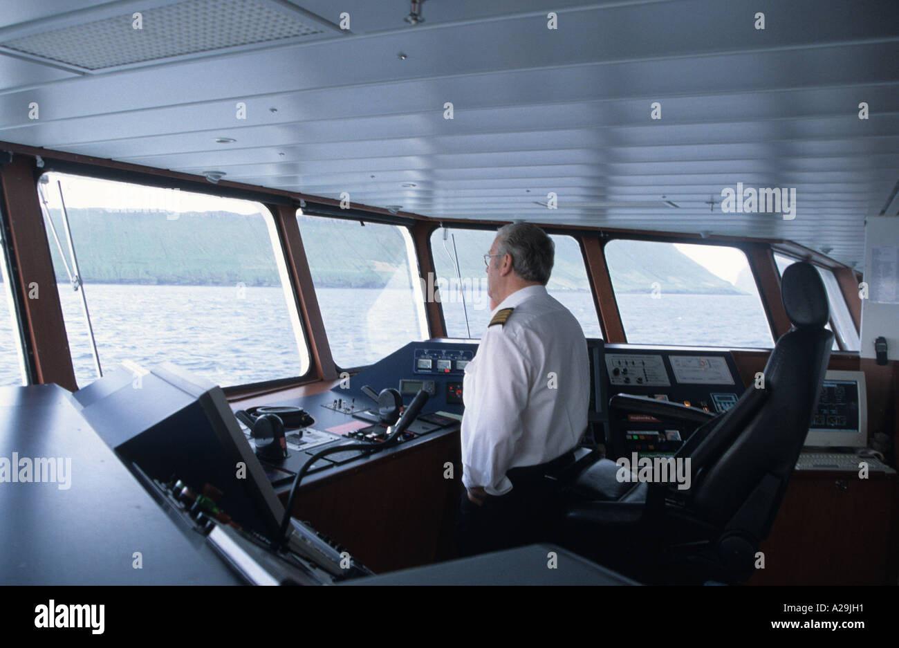 captain at the wheel of interisland ferry in the faroes Faroe Islands ...
