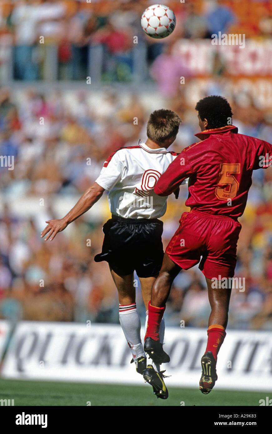 Footballers heading ball hi-res stock photography and images - Alamy