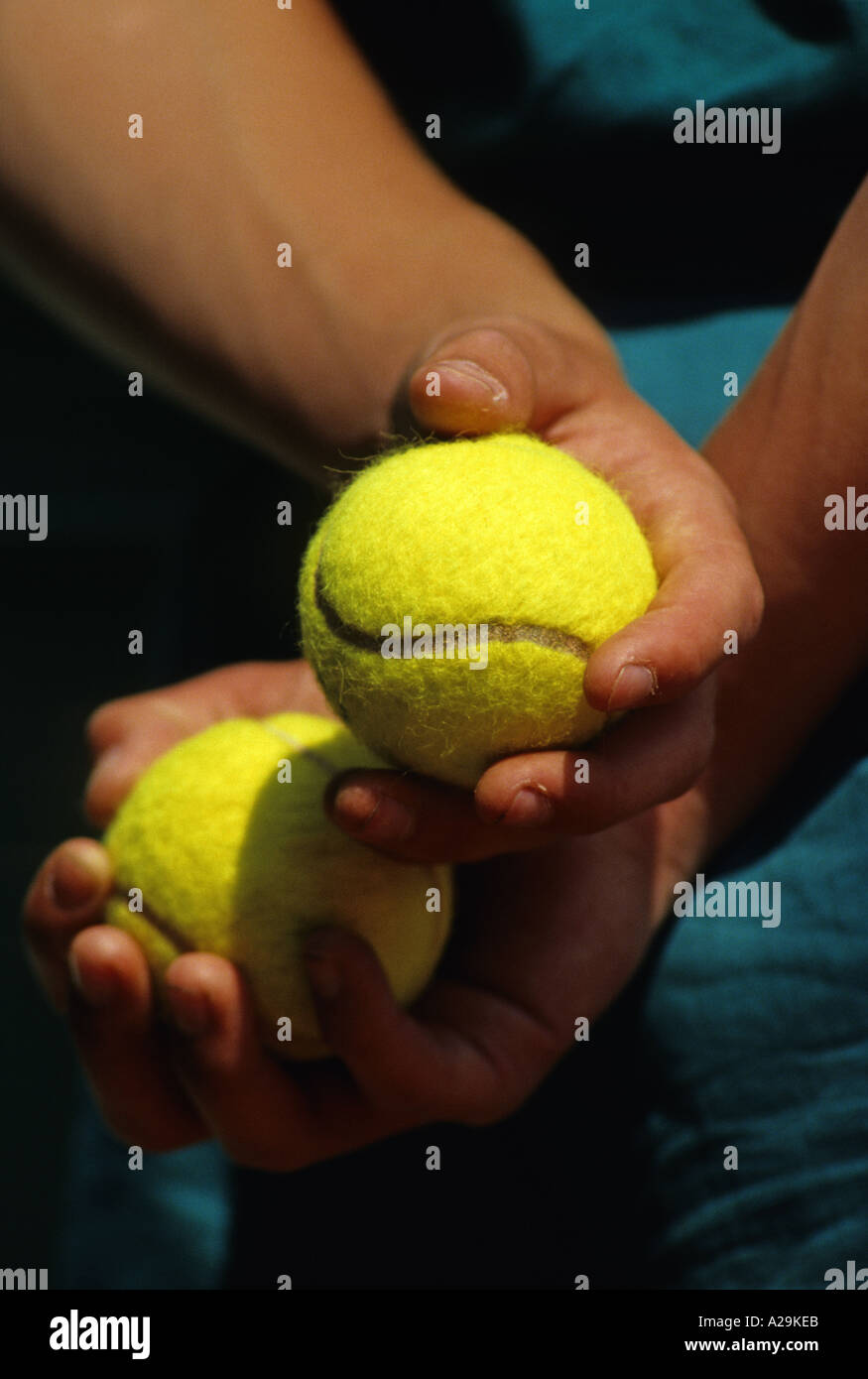 Hand holding two balls hi-res stock photography and images - Alamy