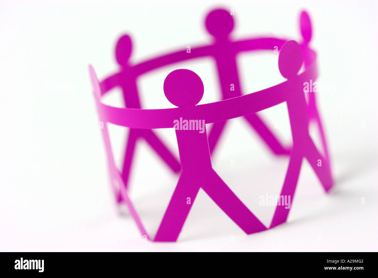 Paper dolls holding hands hi-res stock photography and images - Alamy