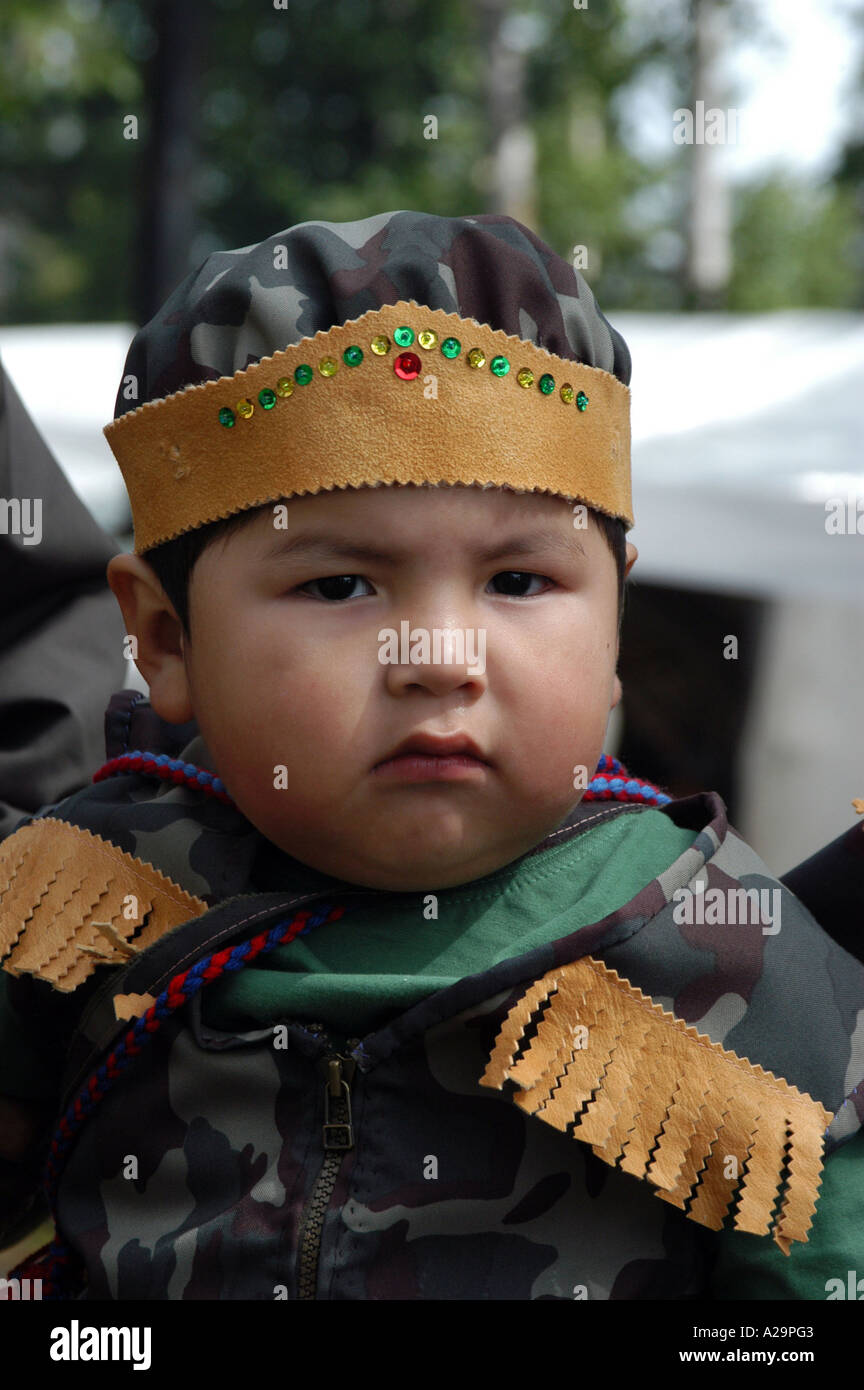 Native cree Baby in traditional costume next to James bay Quebec canada ...