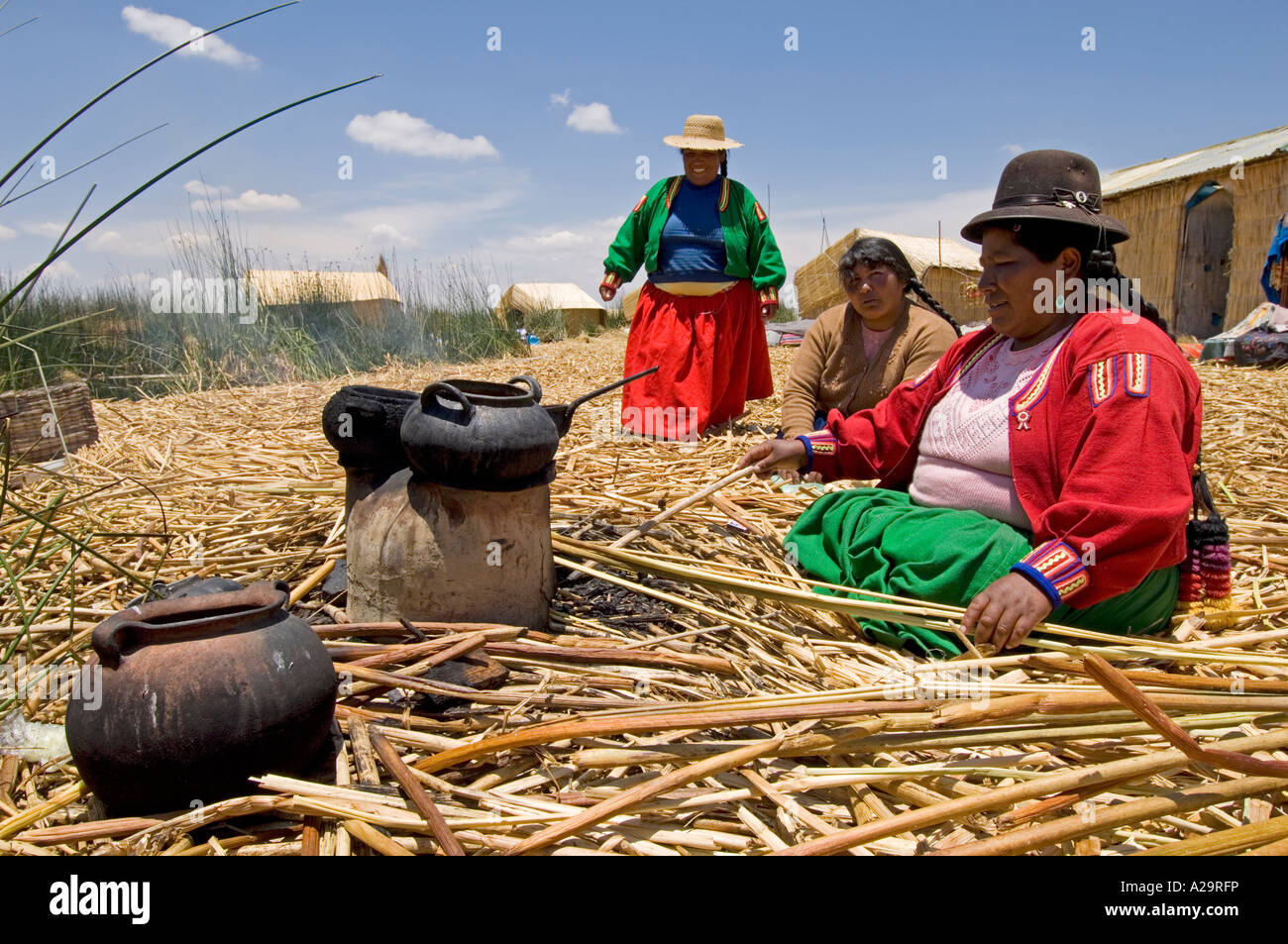 A low wide angle view of a local woman showing traditional cooking ...