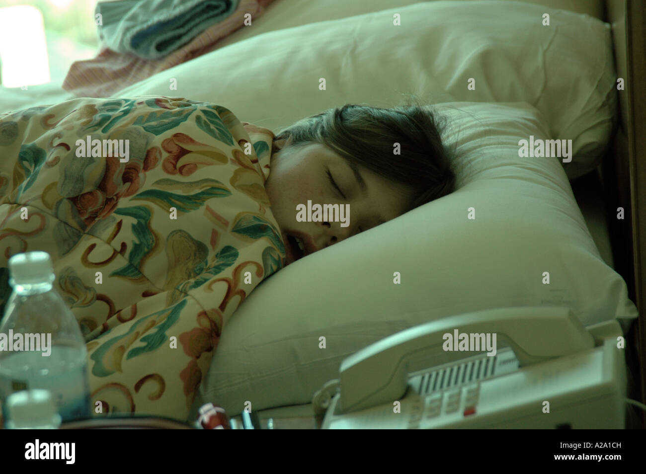 Girl fast asleep in hotel bed room Stock Photo - Alamy
