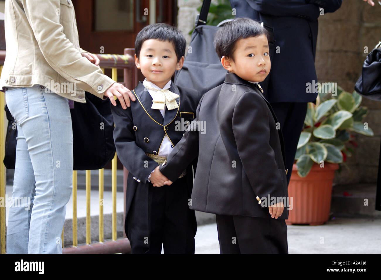 Two boys, part of a wedding ceremony Stock Photo - Alamy