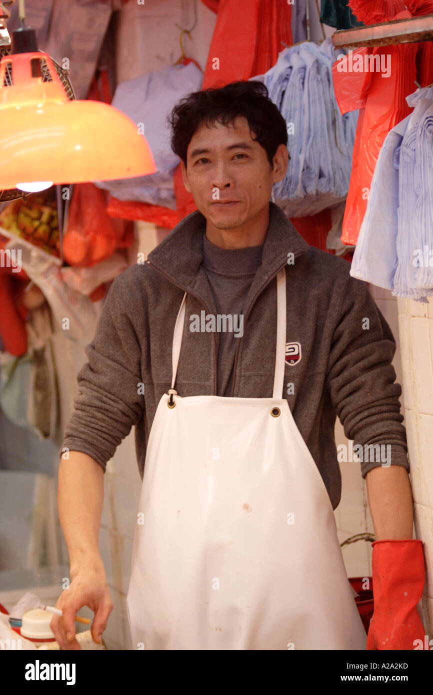 Man at a fresh fish market, Hong Kong, SAR Stock Photo - Alamy