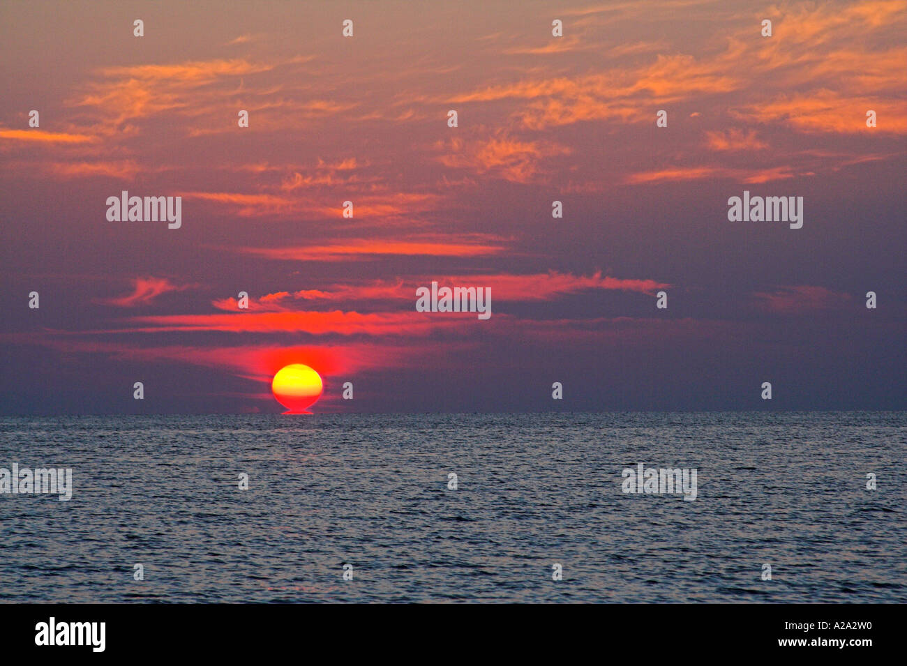 Sunset with reflection Stock Photo - Alamy