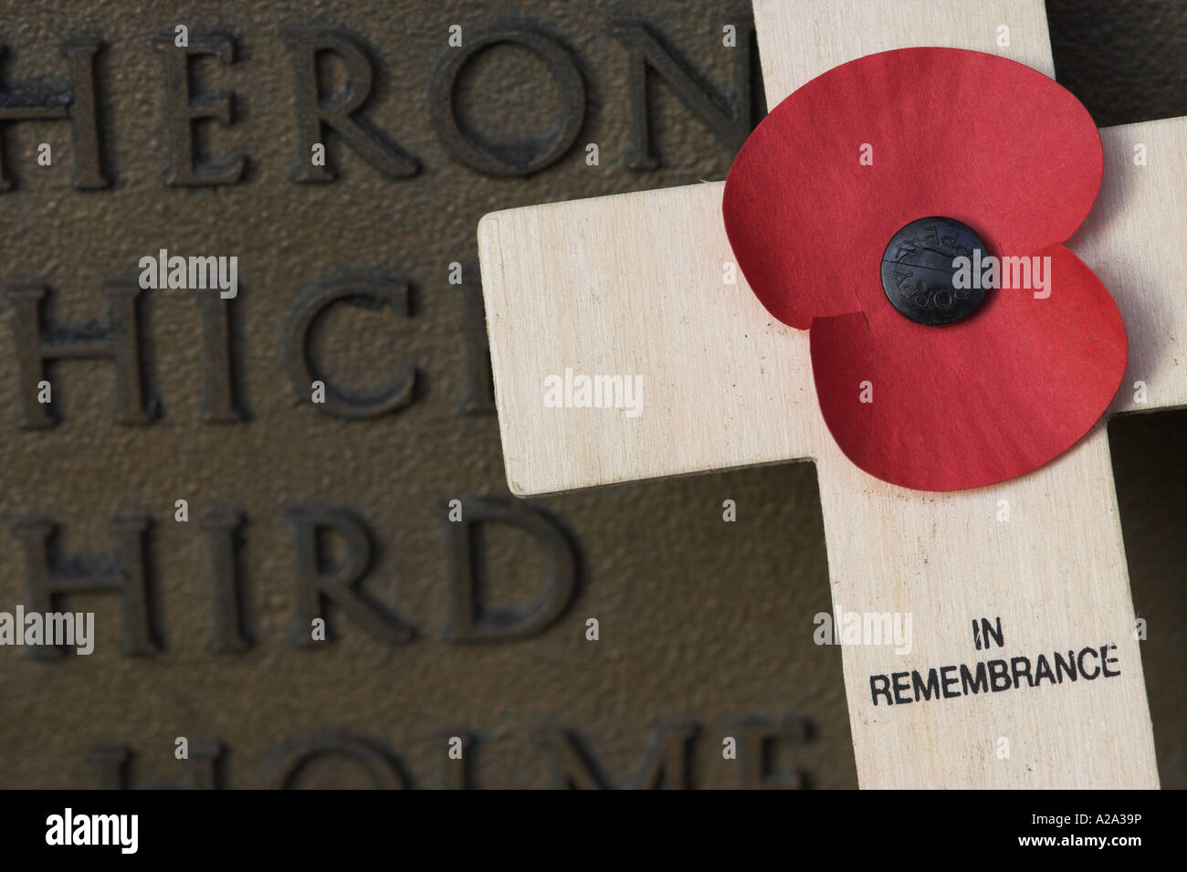 Small section of a World War Two memorial plaque with a wooden ...