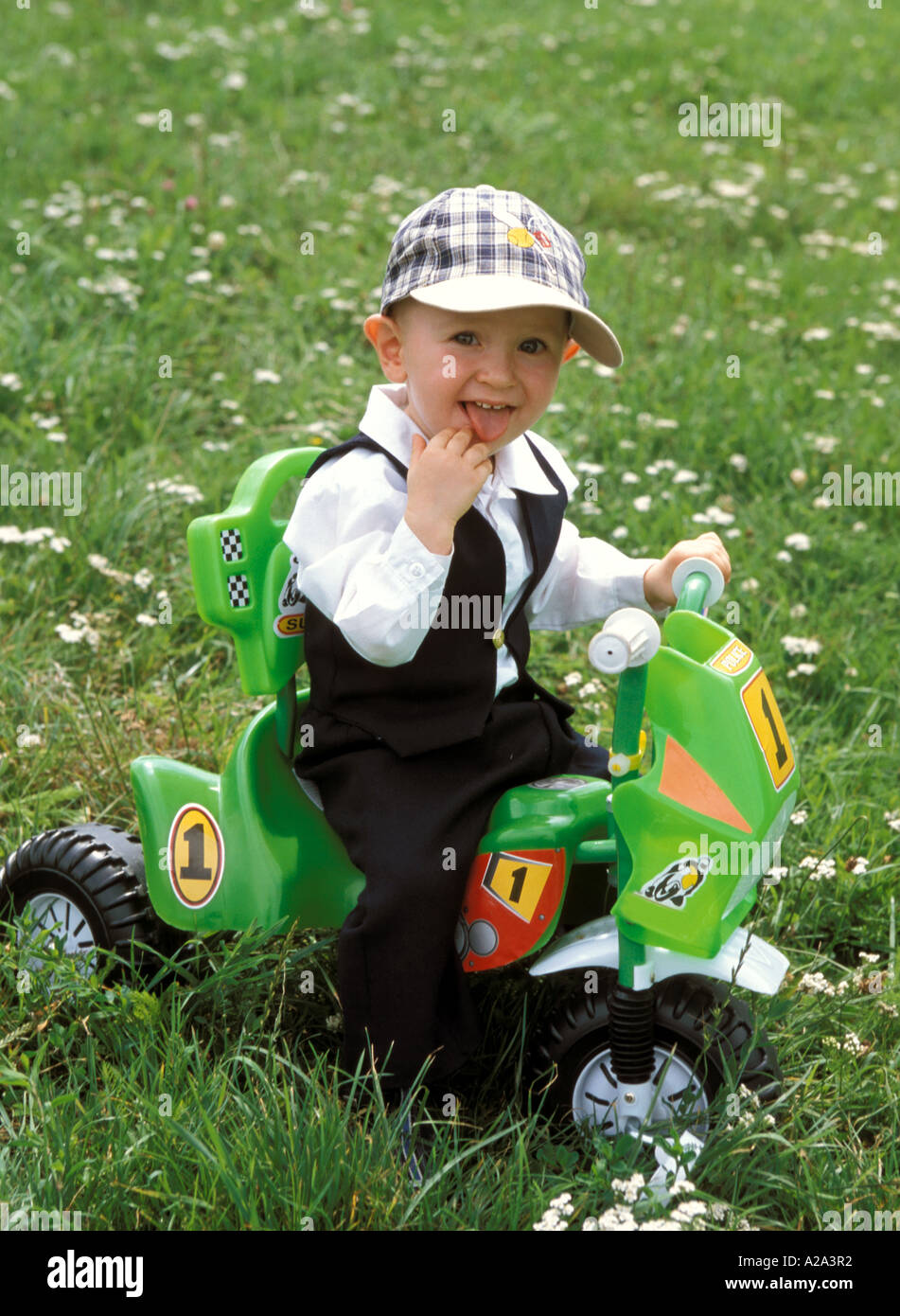 baby boy riding toybike Stock Photo - Alamy