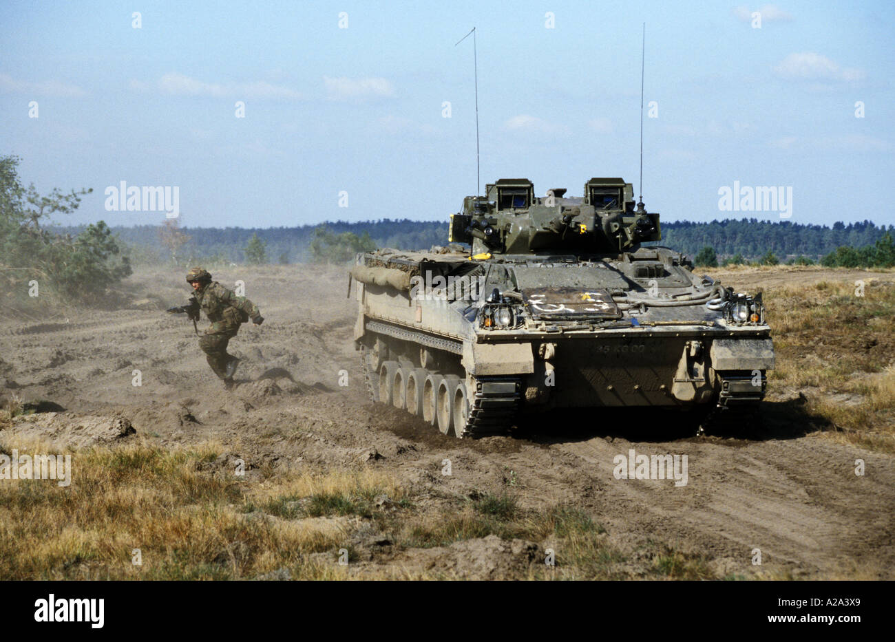 British army soldiers debussing from a Warrior armoured combat vehicle ...