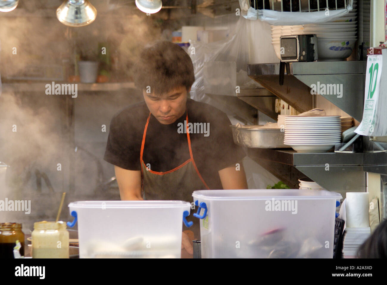 Cooking in a Hong Kong Restaurant Stock Photo - Alamy