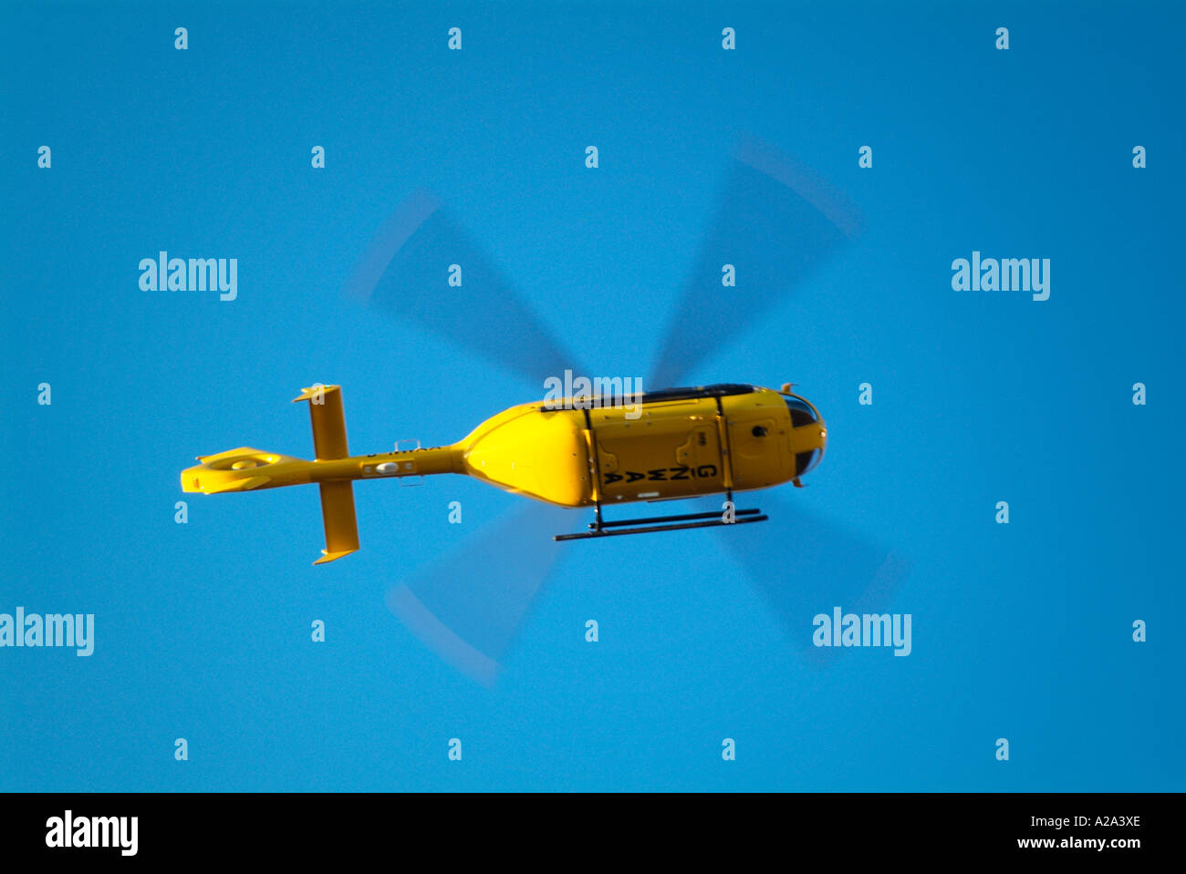 Ambulance rescue helicopter overhead hover yellow England UK United ...