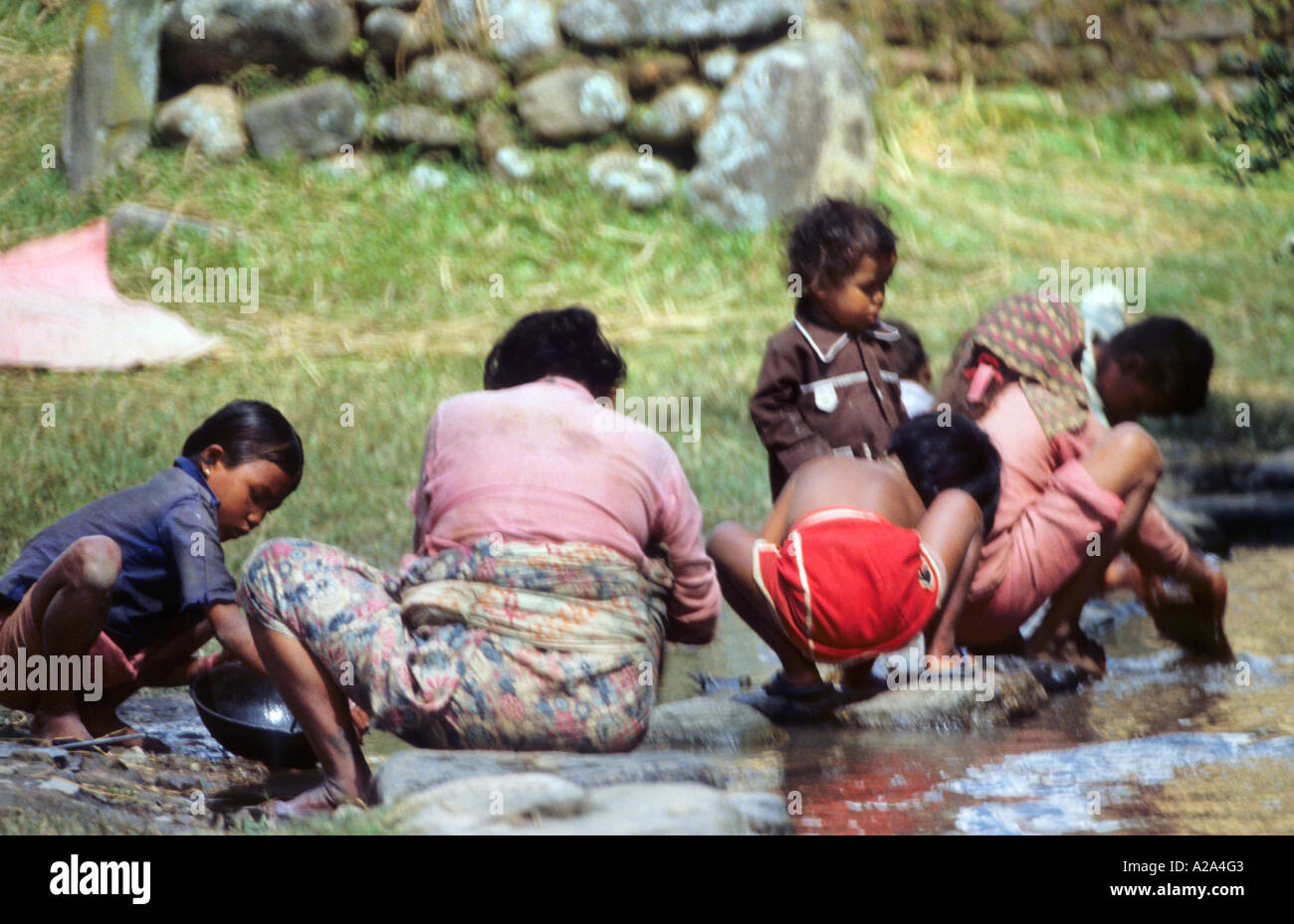 Women child children washing clothes Pashupatinath Bagmati river ...