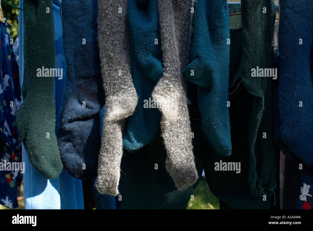 Socks drying on washing line Stock Photo - Alamy
