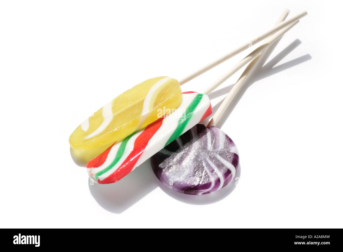 Three lollipops on white ground Stock Photo - Alamy