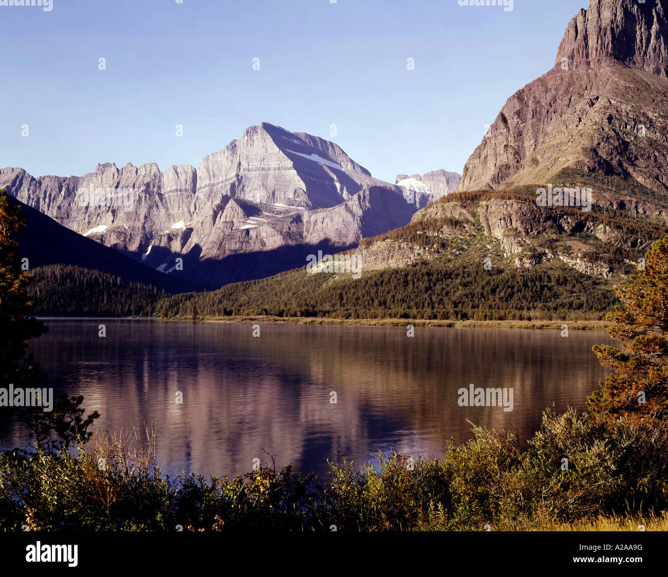 Mount Gould reflected in Swiftcurrent Lake in Glacier National Park in ...