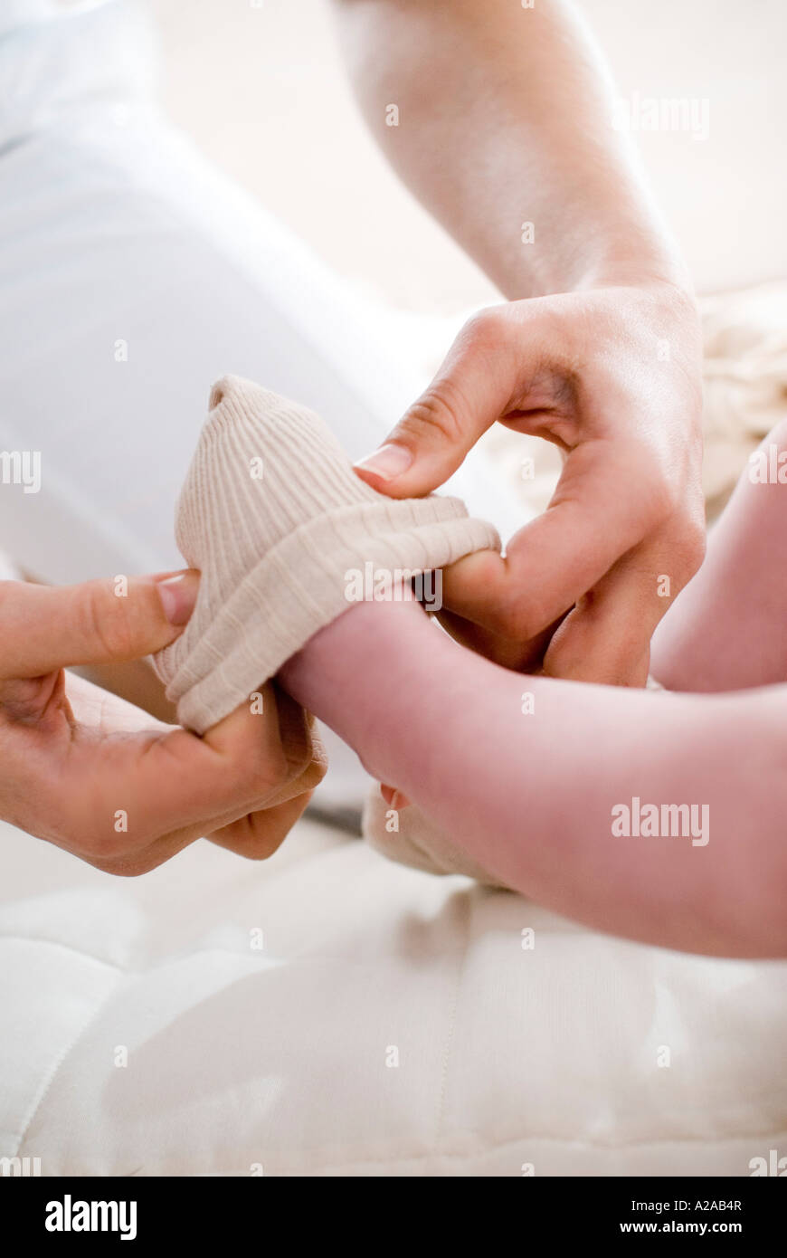 close up of dressing infant Stock Photo - Alamy