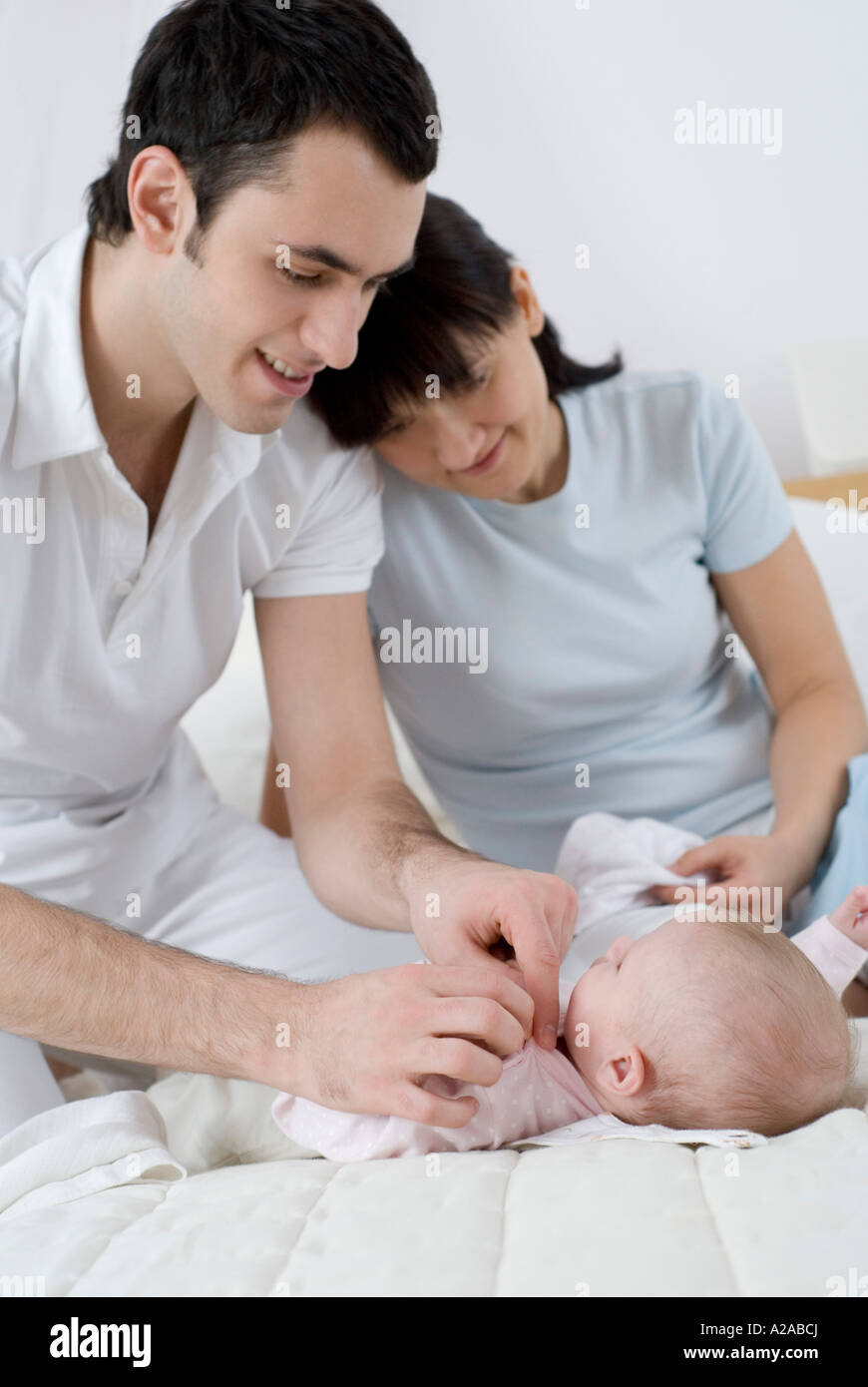 Man changing diaper vertical hi-res stock photography and images - Alamy