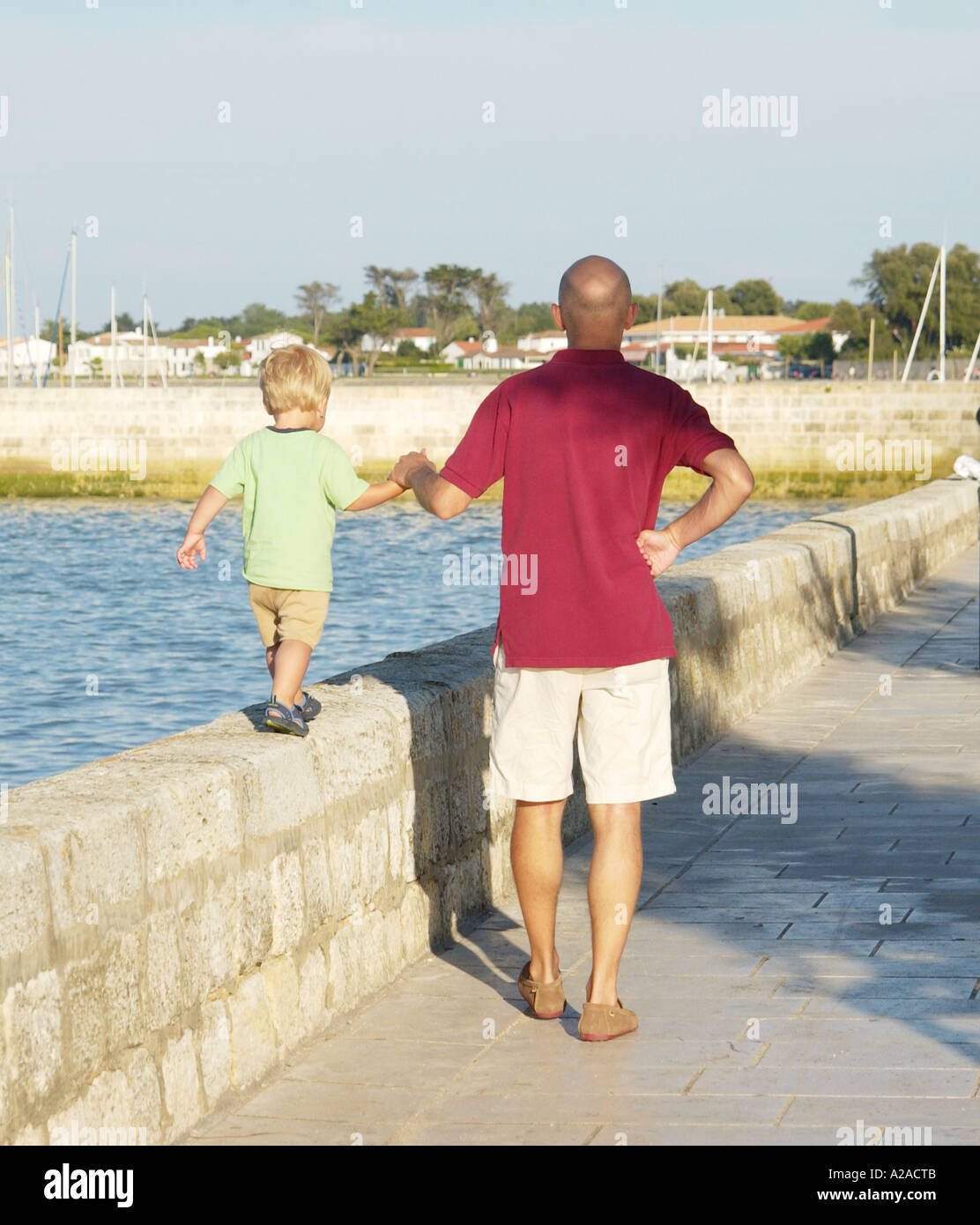 Father and son walking Stock Photo - Alamy