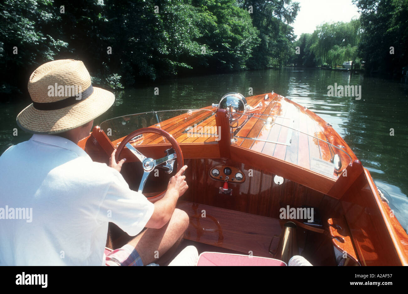 A young man in an electric powered slipper launch River Thames Henley ...