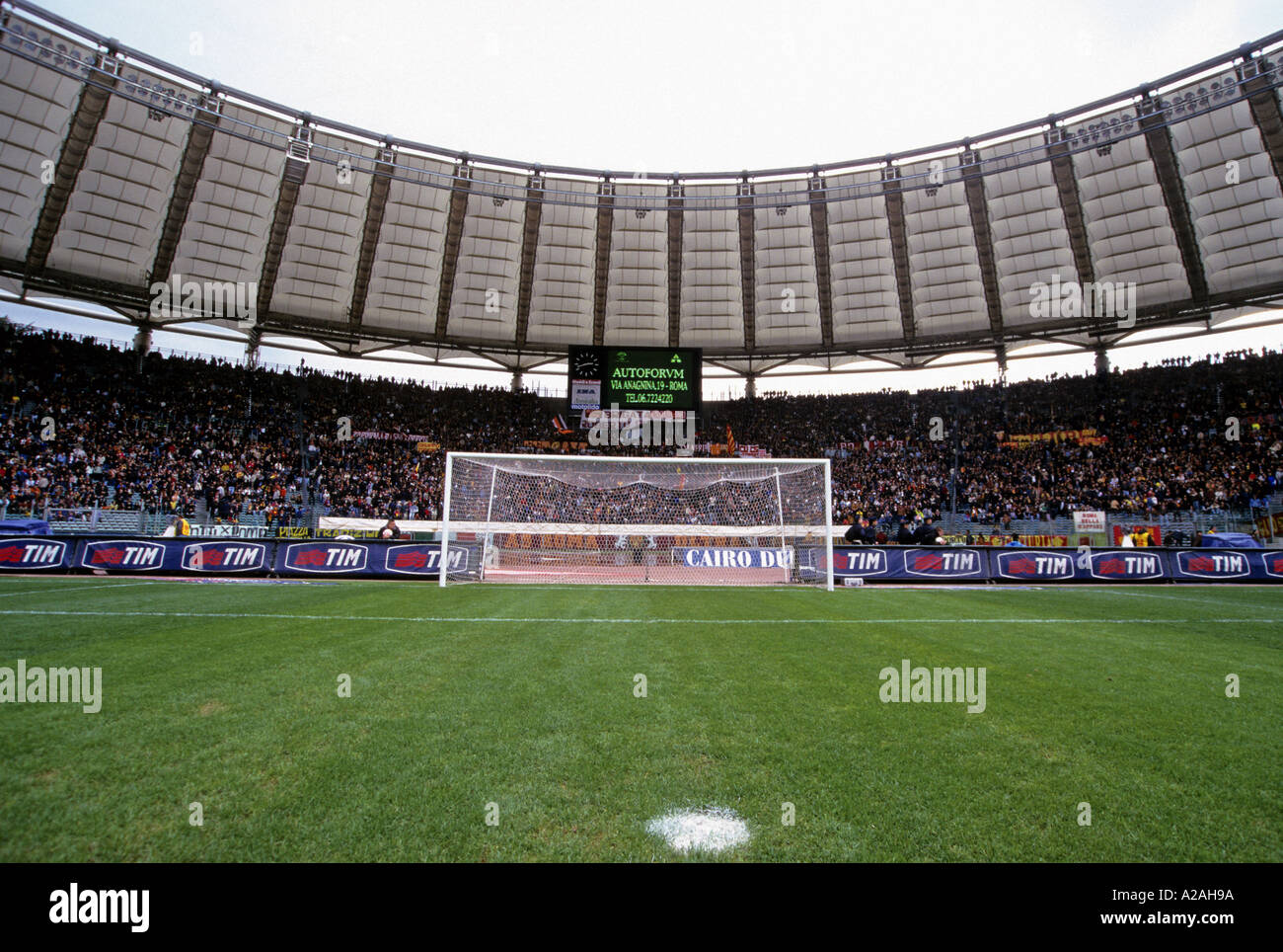 View of the empty goalmouth and supporters in the stands behind taken ...