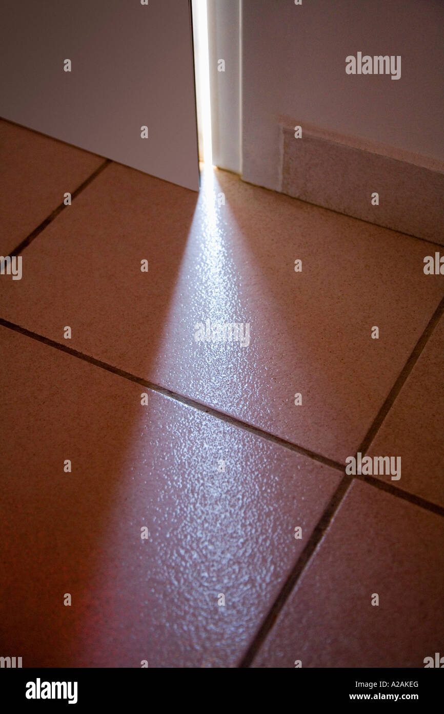 Ray of light through doorway Stock Photo - Alamy
