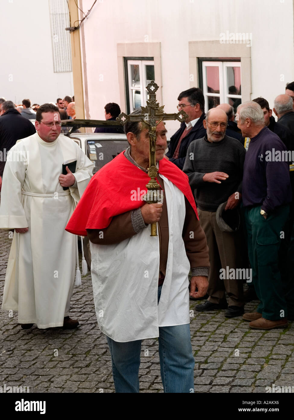 Priest heading a funeral procession at Monchique, Algarve, Portugal ...