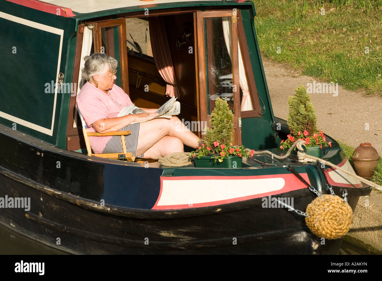 Relaxing on the front deck of a Narrowboat Stock Photo - Alamy