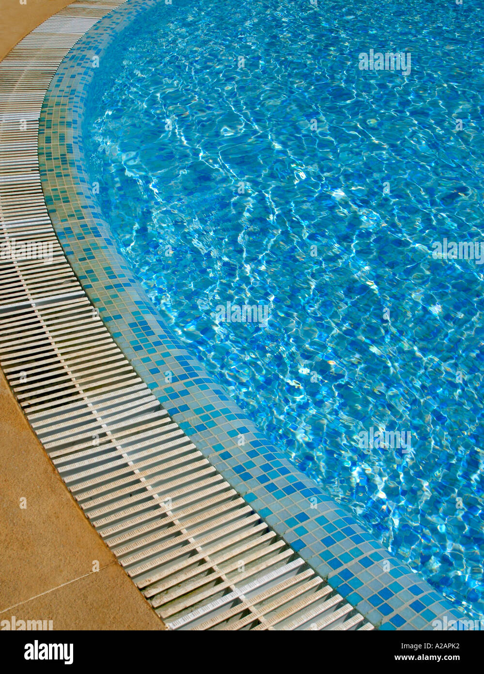 Swimming pool with blue water in summer sunshine Stock Photo - Alamy