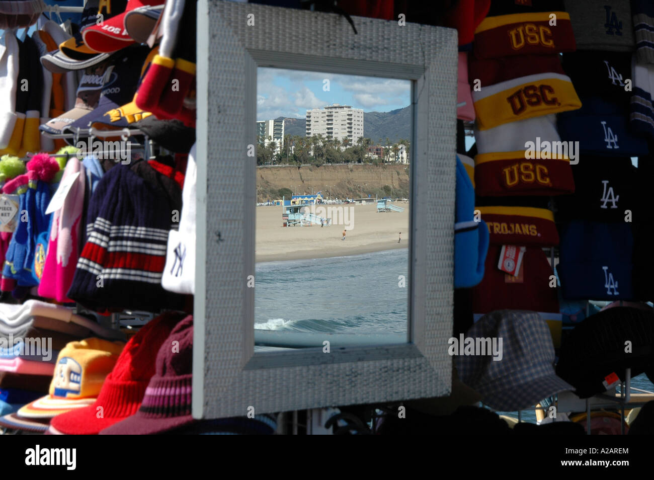 Reflection of Santa Monica Beach in mirror on a hat stall on Santa ...