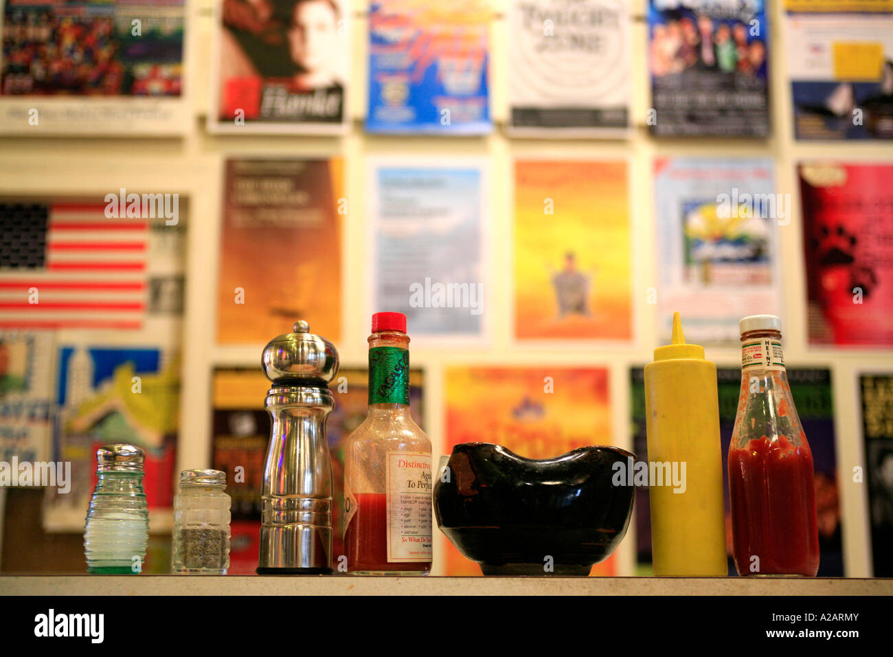 condiments lined up along diner bar Stock Photo - Alamy
