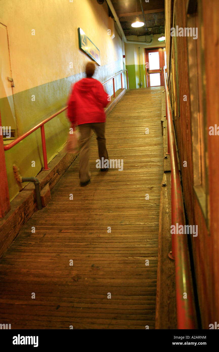 person walking up timber ramp Stock Photo - Alamy
