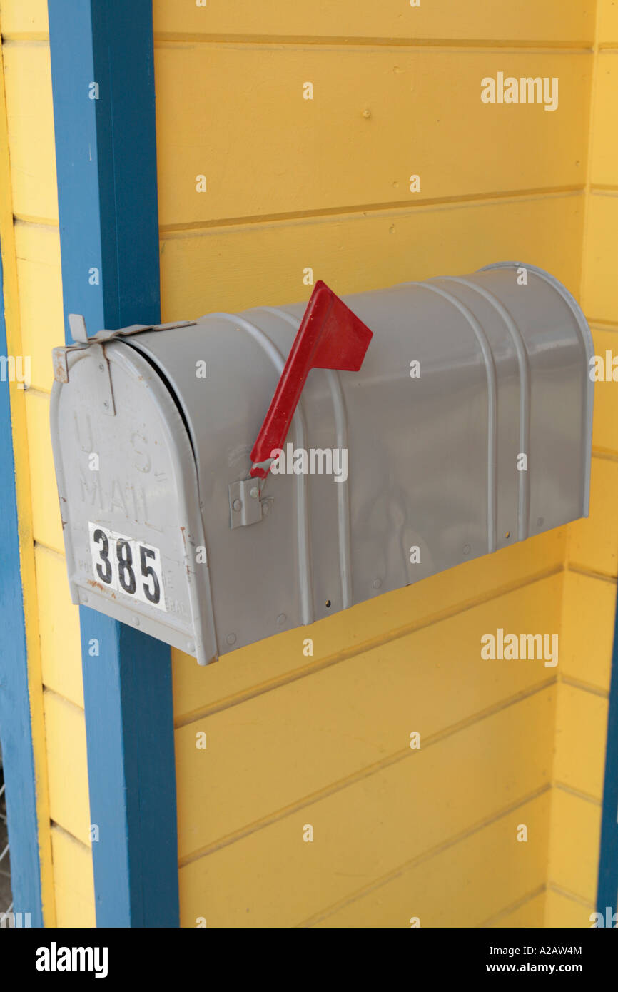 mail box fixed to side of brightly painted timber wall Stock Photo - Alamy