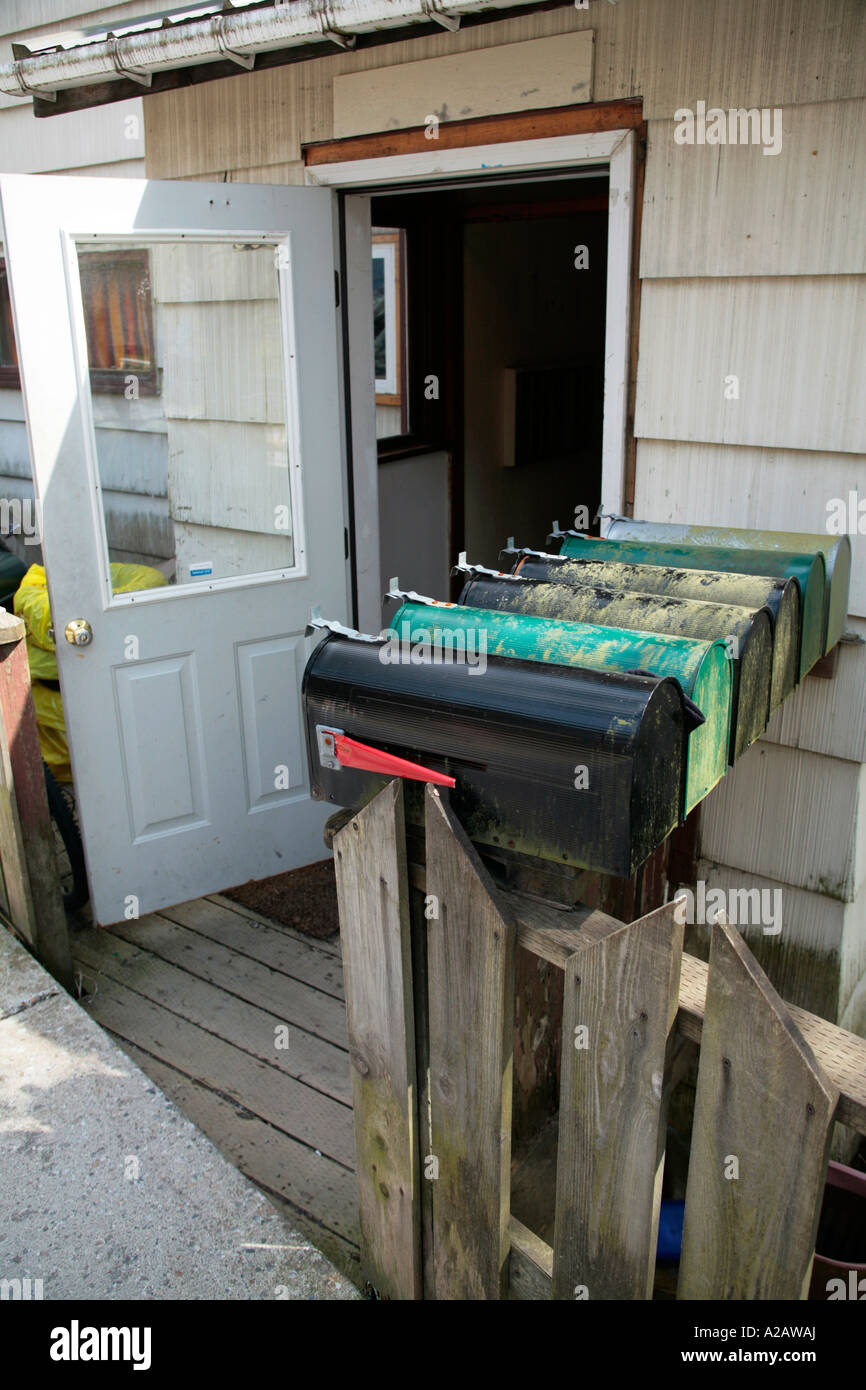 multiple mailboxes in front of house Stock Photo - Alamy