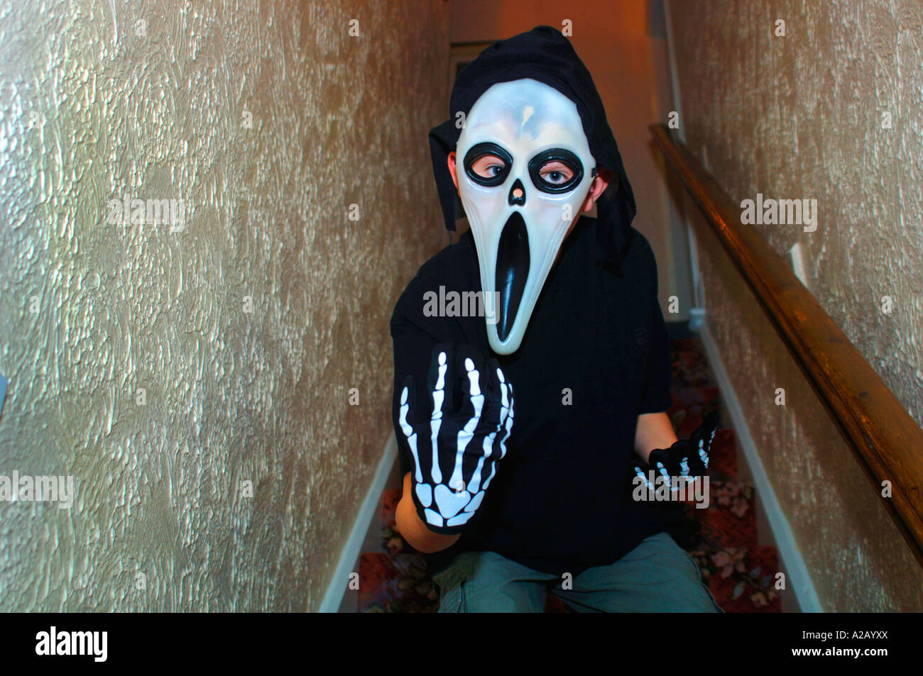 Boy Dressed Up For Halloween ,Wearing A Scary Movie Mask & Gloves.Also ...