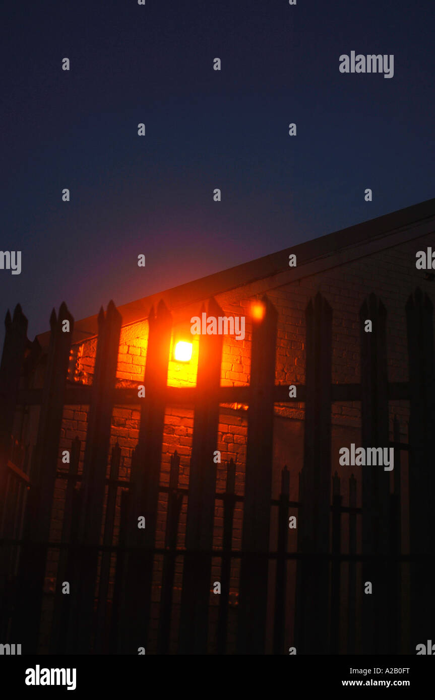 Security Light Bright & Glowing On The End Of A Building,Taken Through ...