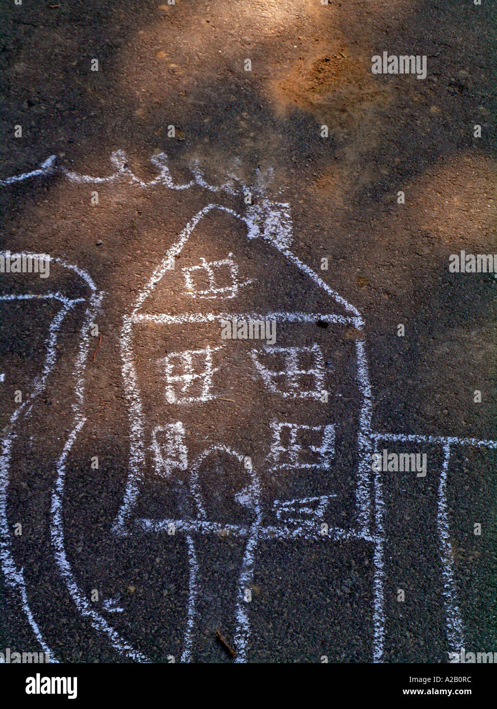 chalk drawing of children on a street home house Stock Photo - Alamy
