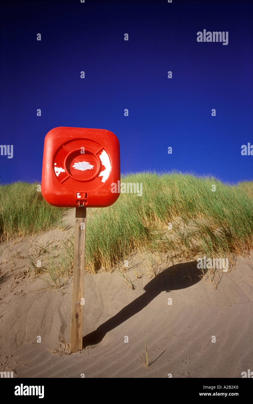 Red life ring on abeach in Somerset Stock Photo - Alamy
