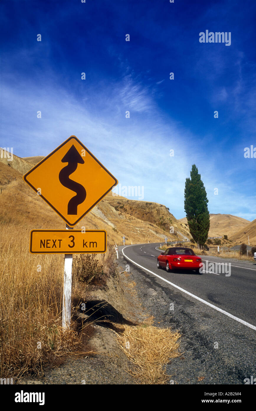 Road sign warning of a upcoming bends Stock Photo - Alamy
