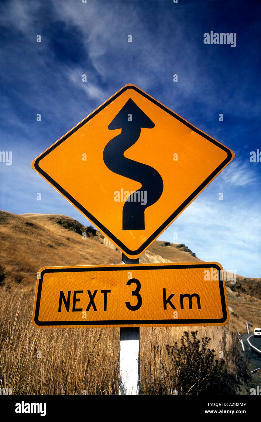 Road sign warning of a upcoming bends Stock Photo - Alamy