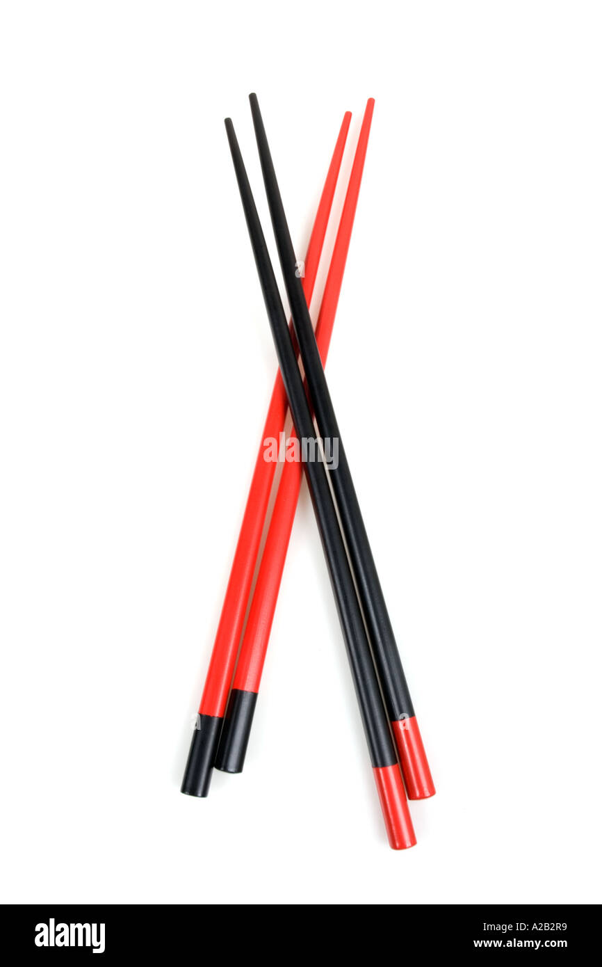 Close up of red and black Chopsticks paire couple of crossed SYMBOL ...