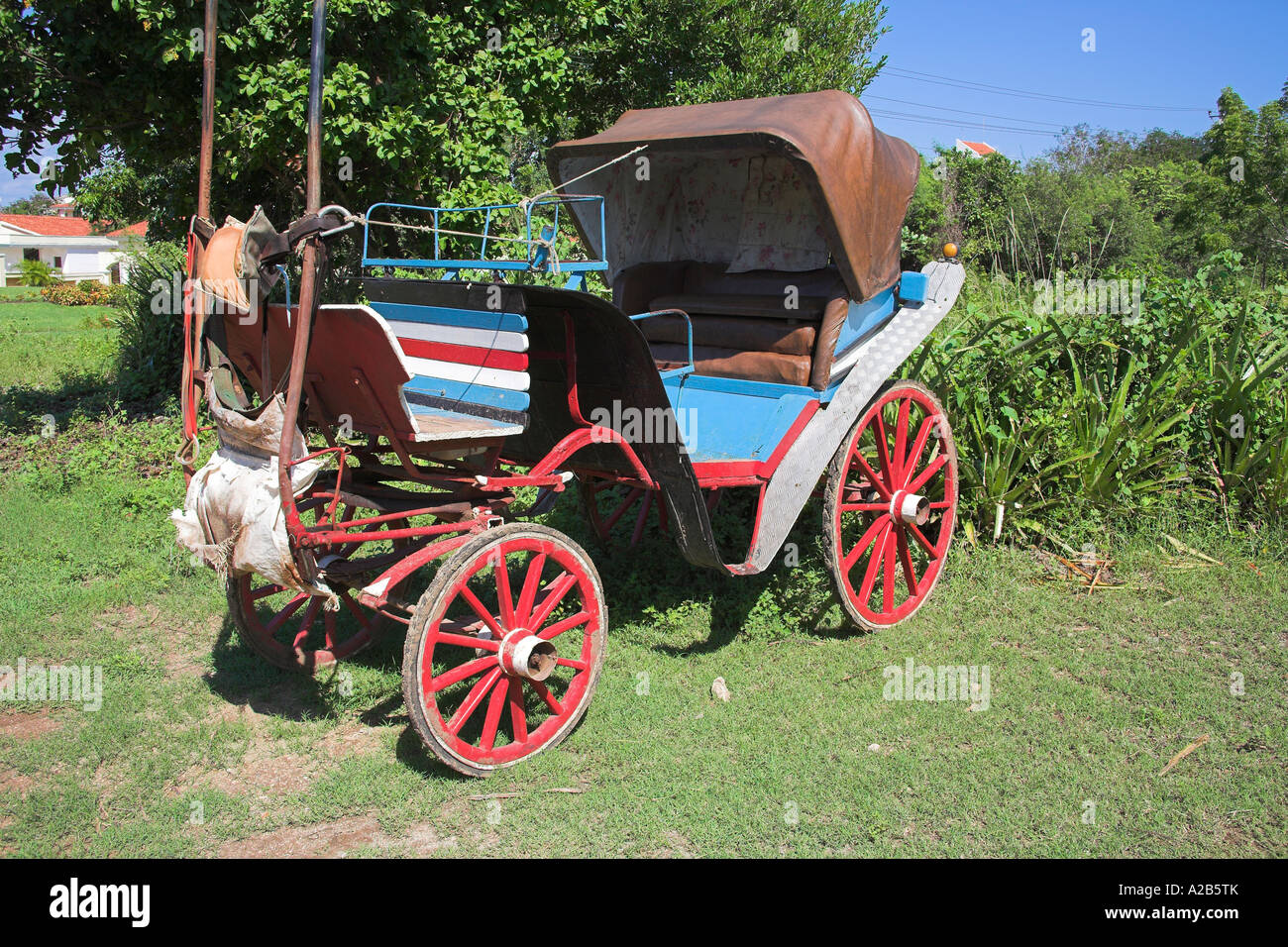 Old horsedrawn wooden carriage in a garden, Guardalavaca, Holguin ...