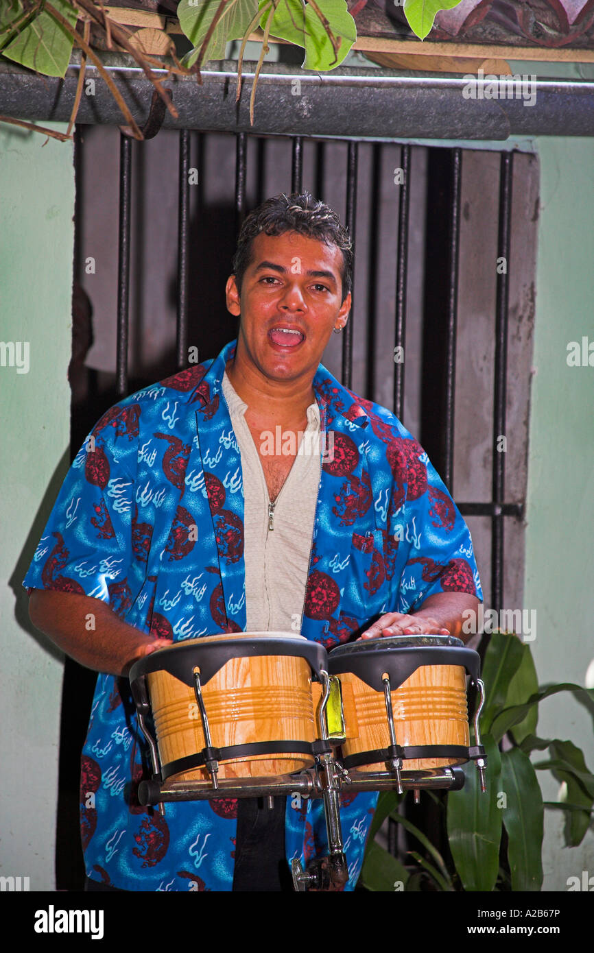 Man singing and playing bongo drum, Casa de la Trova, location for ...