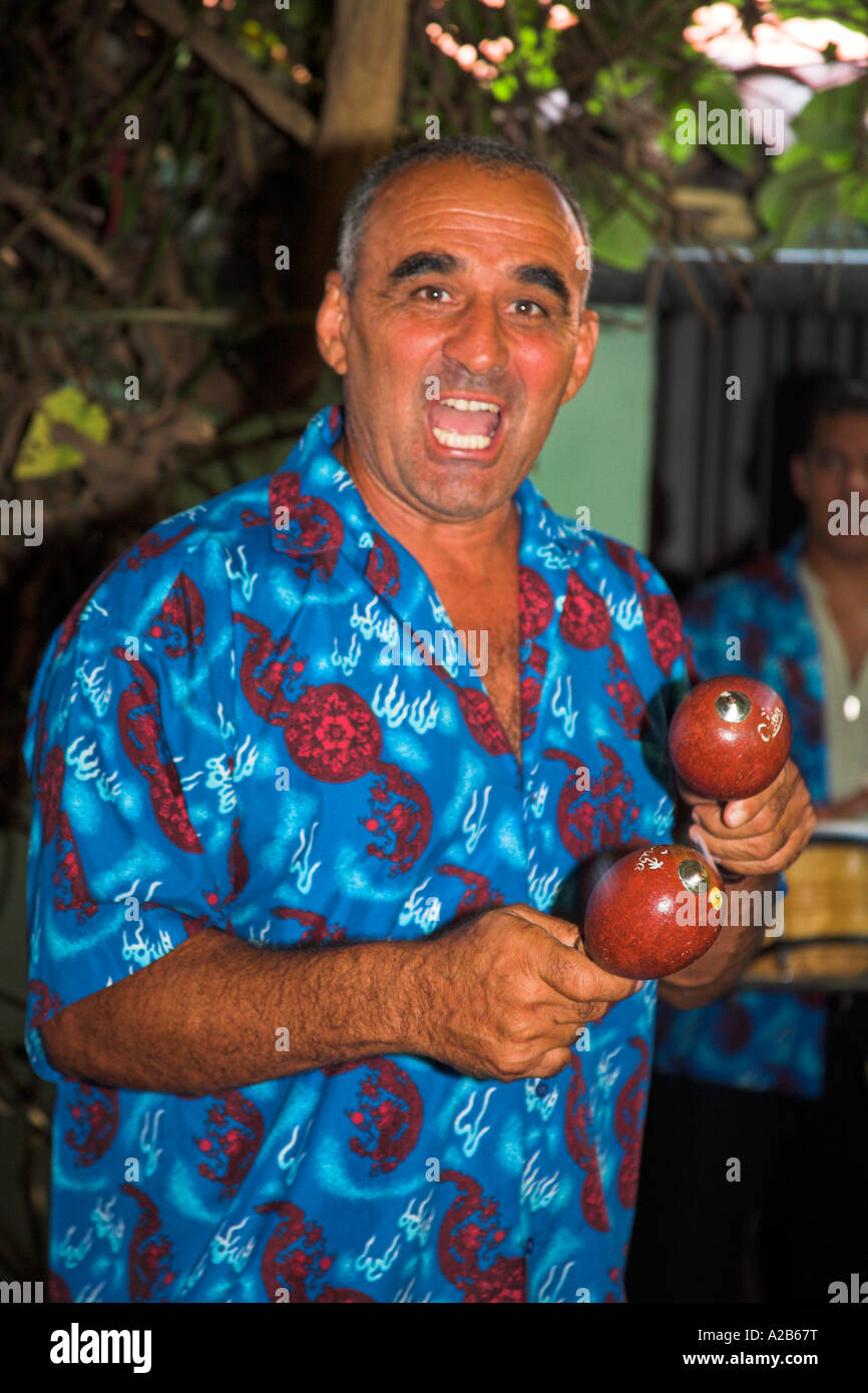 Man singing playing maracas casa hi-res stock photography and images ...