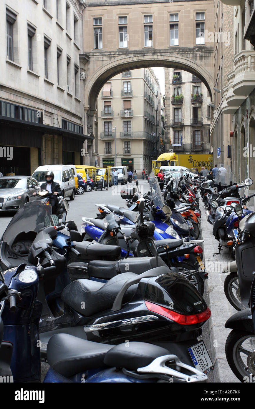 Mopeds and Morotbikes parked on a street in Barcelona Spain Europe ...