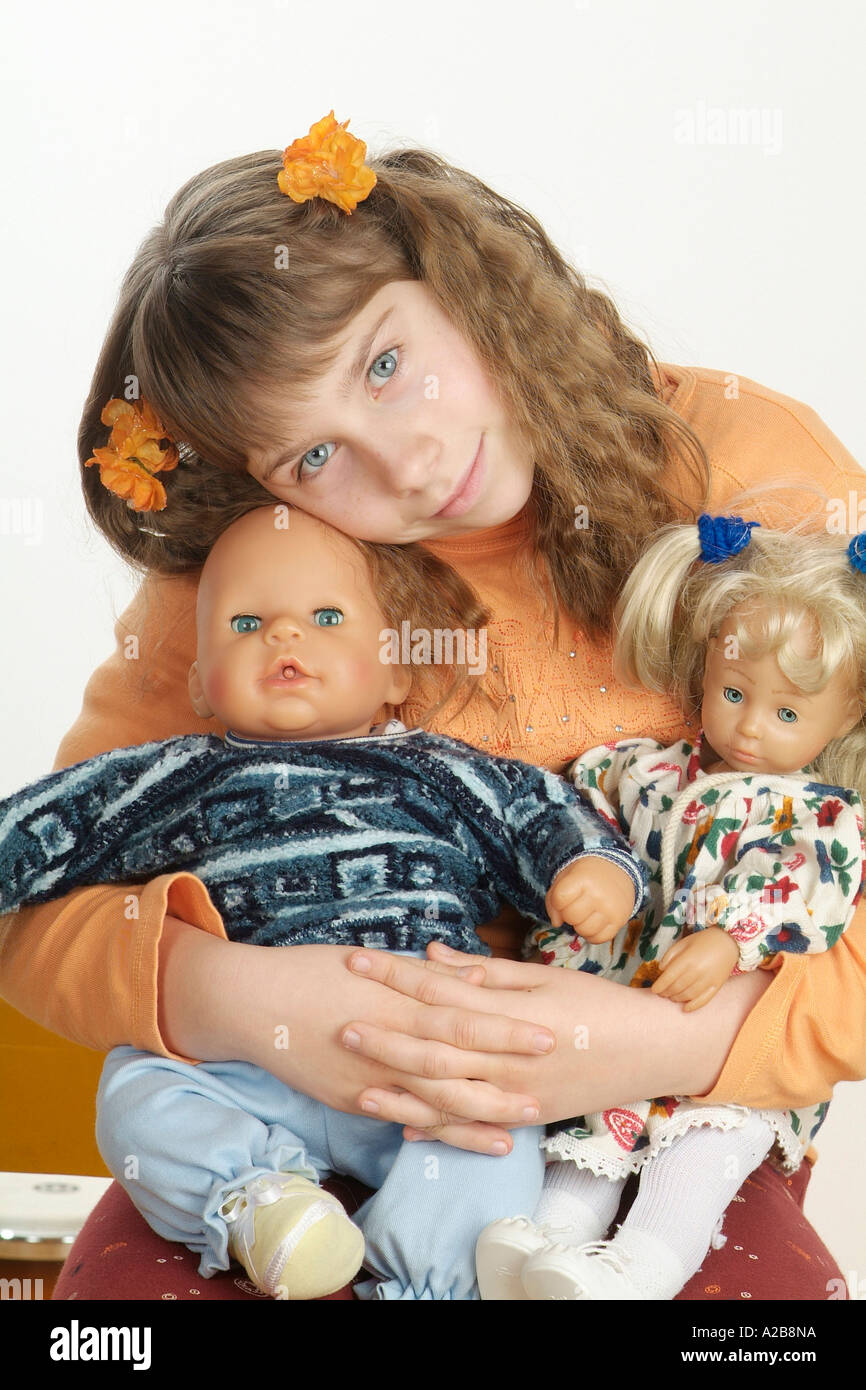 Girl with doll Stock Photo - Alamy